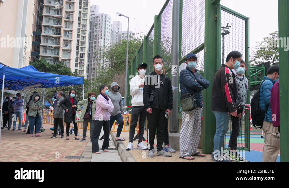 Citizens queue in line to be tested for Covid-19 coronavirus outside a ...