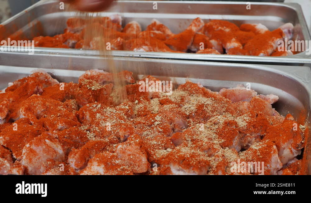 Sprinkle fragrant spices with salt and red ground paprika on chicken ...
