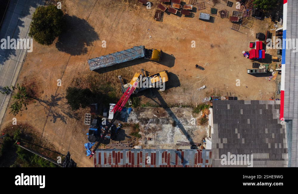 Crane operators and mobile cranes working at a construction site Stock ...