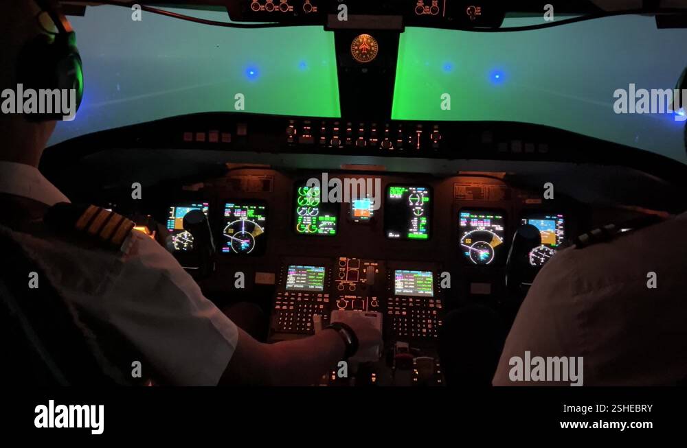 Jet cockpit view looking fordward during a taxi-out during the night ...