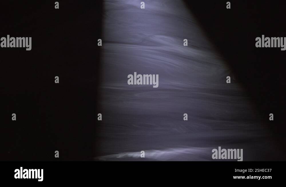 Thick grey smoke in cone light, effect on stage, no background light ...