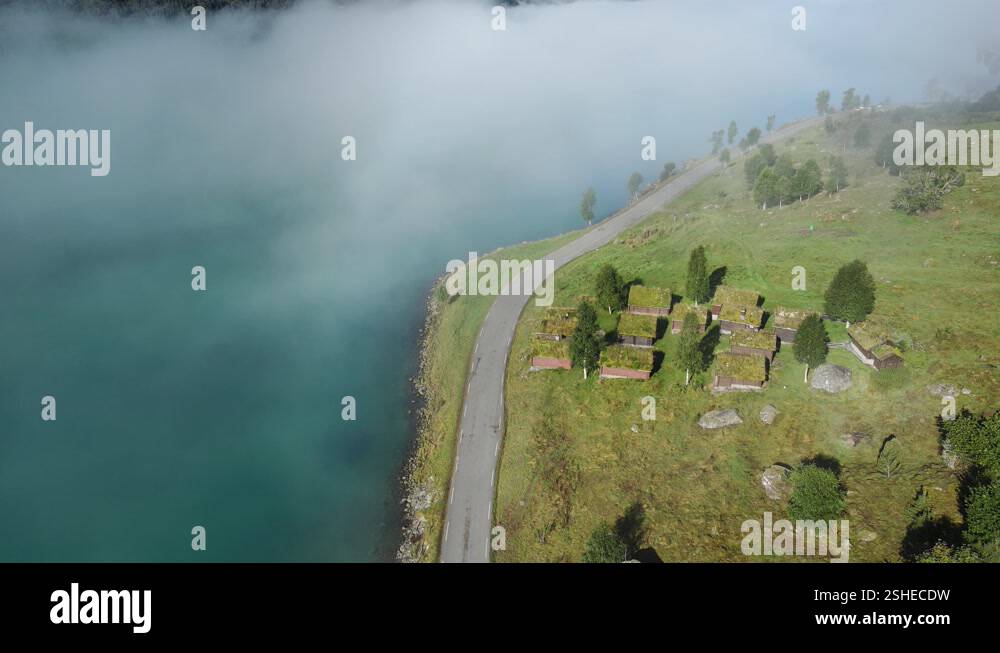 Lovatnet glacier lake and Breng seter historical farm houses. Drone ...