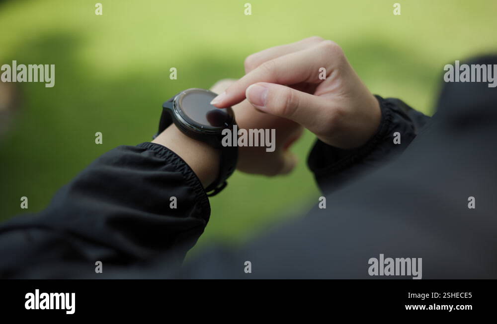 Close-up checking sportswear adjusting smart watch before workout in ...