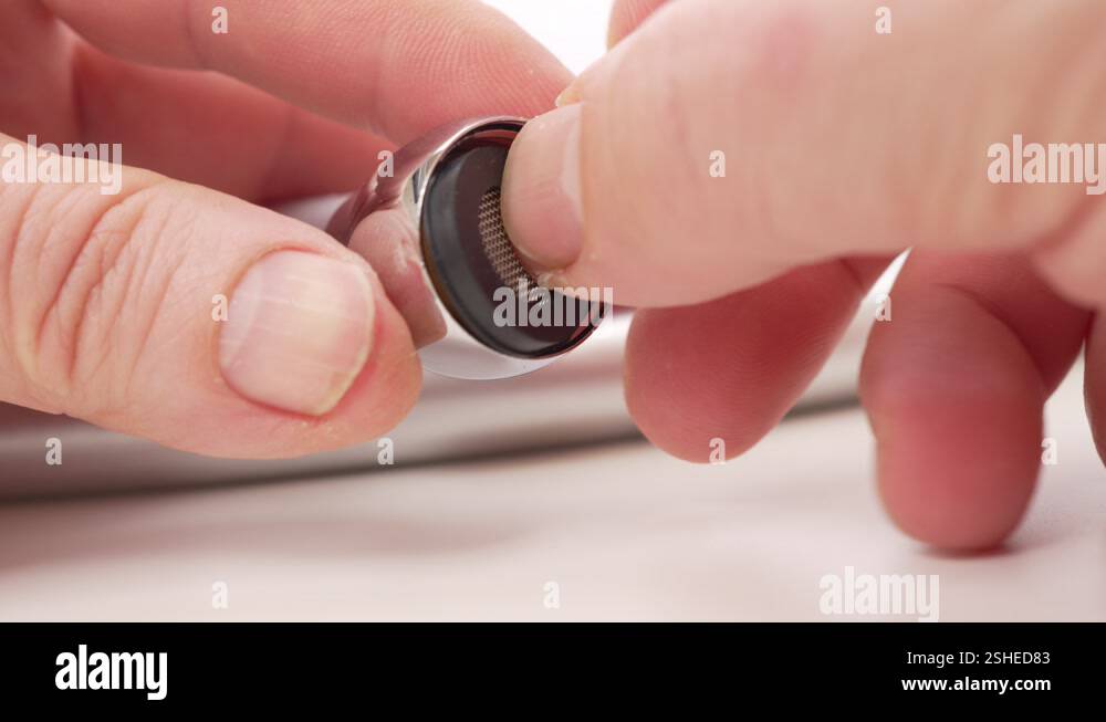 men's hands insert a coarse filter mesh into the shower hose Stock ...