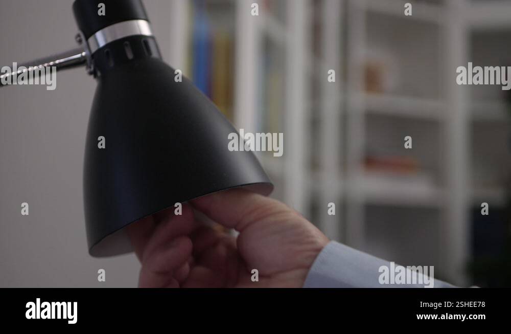 Shooting with a Person Turning Off the LED Light from a Lamp Stock ...