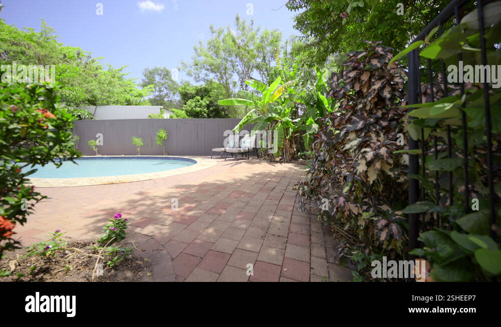 Concrete tiled patio veranda outdoor area. Luxurious pool coping edging ...