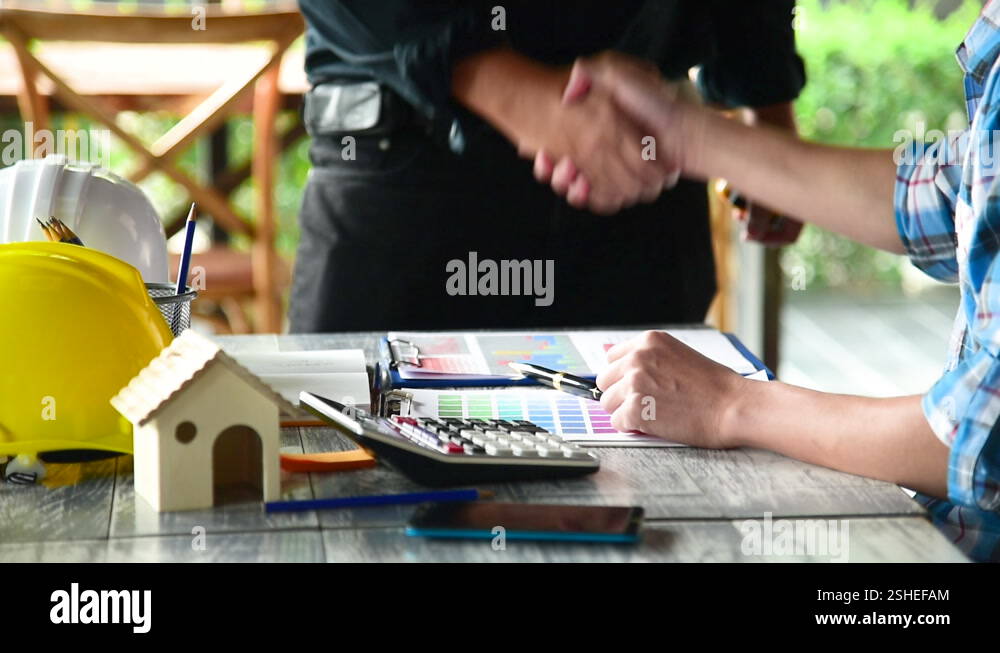 Contractor construction engineer meeting together on architect table at ...