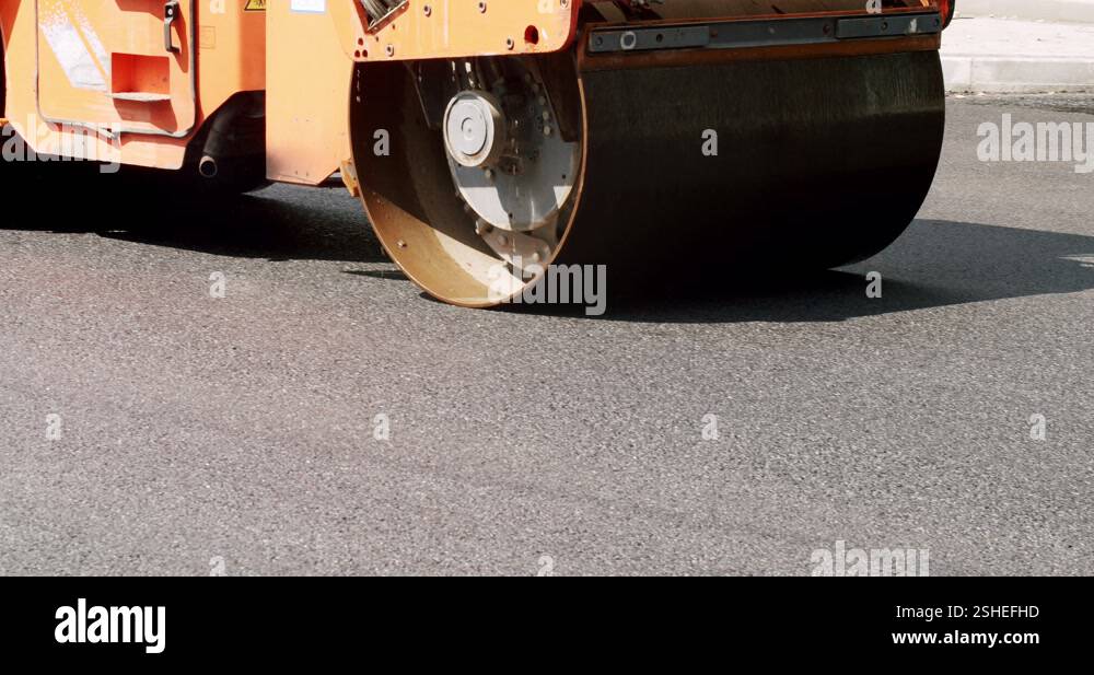 Asphalt paver machine on a road construction site. Road Paving on ...