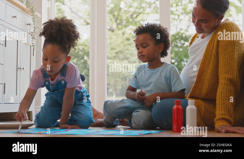 Pregnant Mother With Children Making Welcome Home Banner For Army ...
