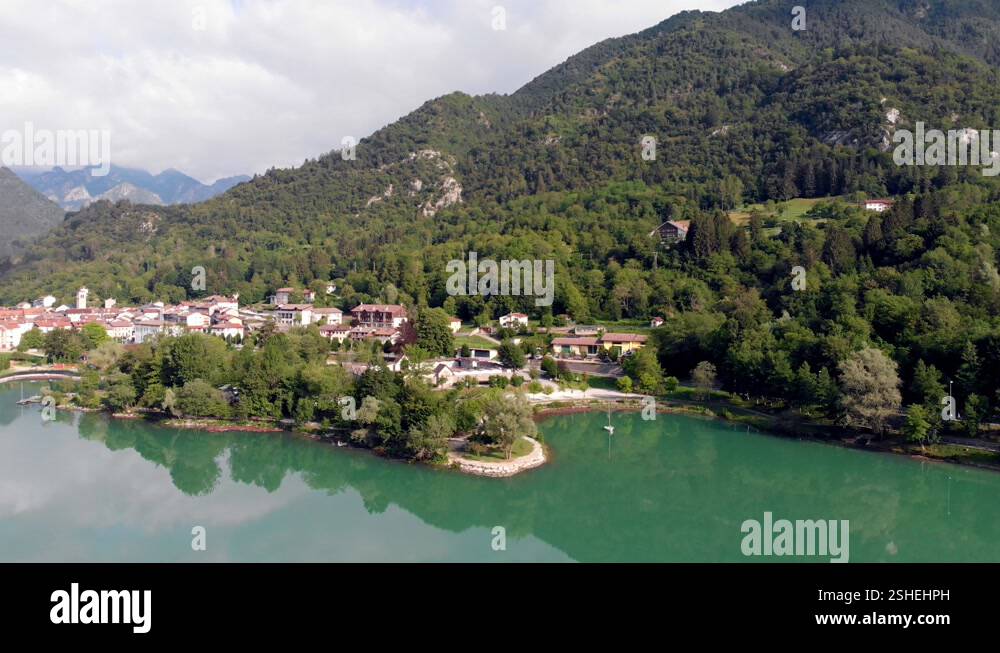 fast reveal aarial footage of the village Barcis in the Dolomites ...