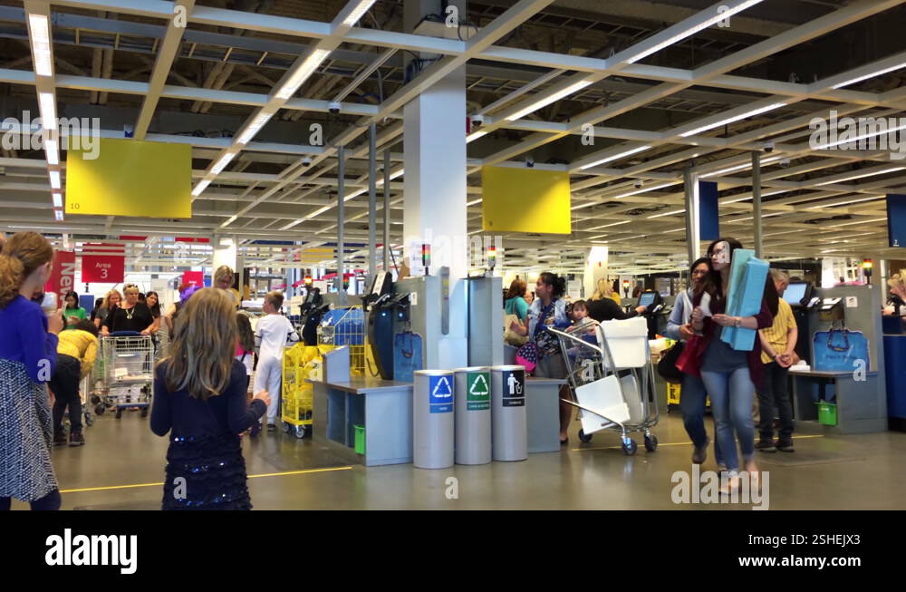 The motion of people paying products at the self check out counter ...