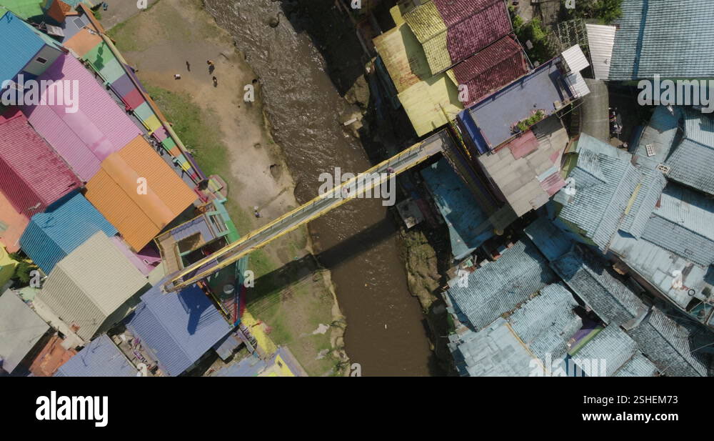 Aerial Top Panning Shot Of People Standing On Bridge In Colorful ...