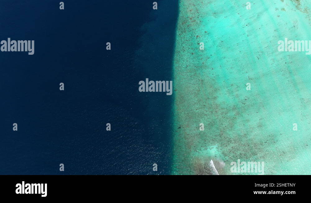 Aerial Top View Of Wave Splashing Near Atoll In Sea On Sunny Day, Drone ...