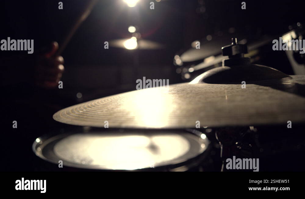 Expressive musician artist man drummer is playing hitting drums and ...