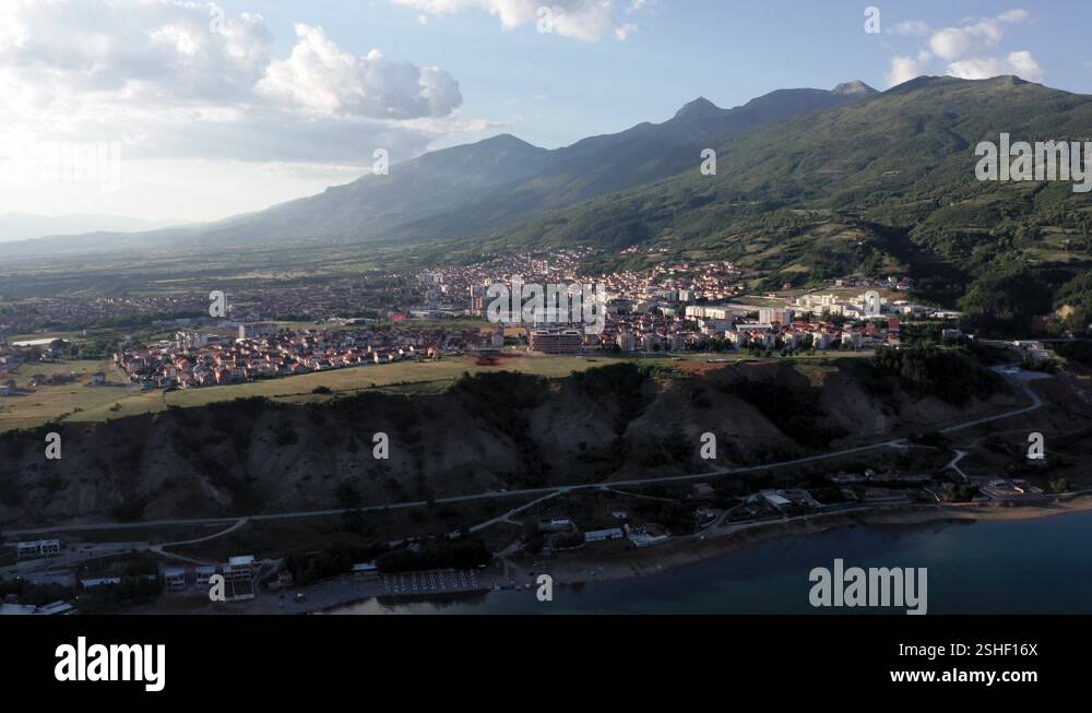 Drone lifting shot of the city of Debar on the reservoir Black Drin ...