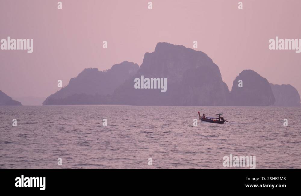 Traditional Boat Sailing Across The Seascape In Phi Phi Group Of ...