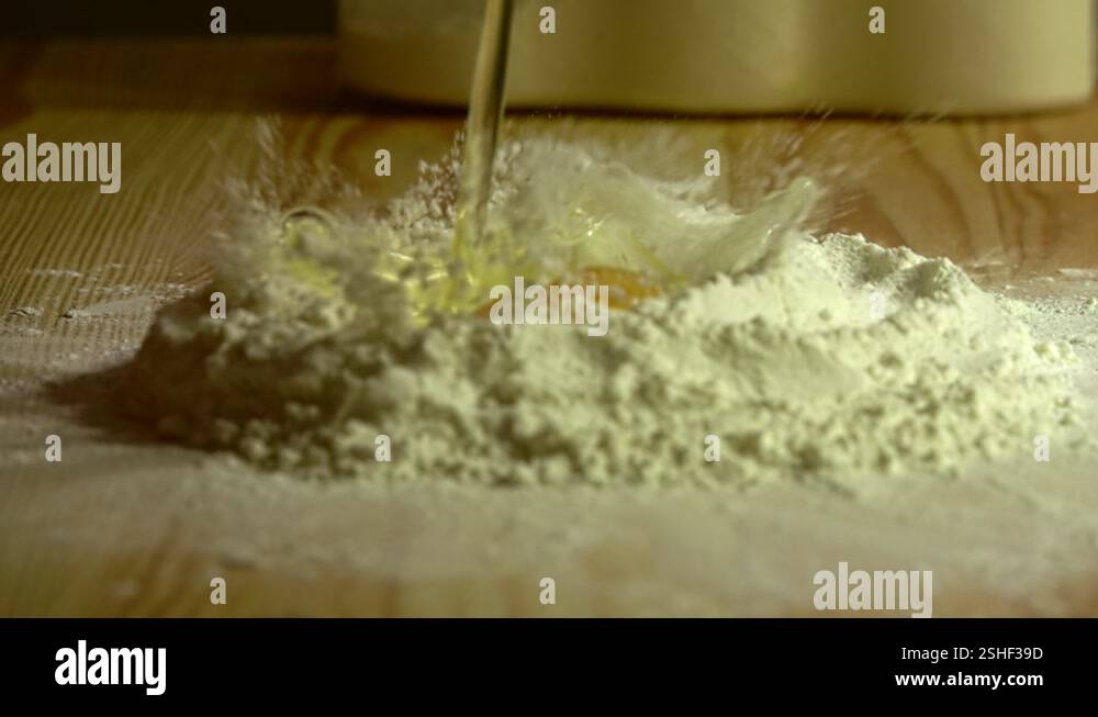 Dropping egg on flour, means for making cookies Stock Video Footage - Alamy