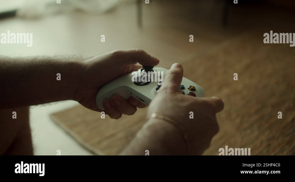 Man gamer hands holding modern console for play station close-up, guy ...