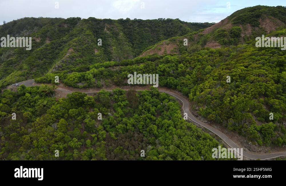 Aerial approach towards road in Halawa Valley in Molokai Hawaii ...