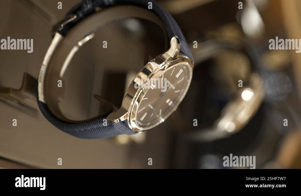 VERTICAL Macro side view of Baume Mercier luxury watches on display in ...