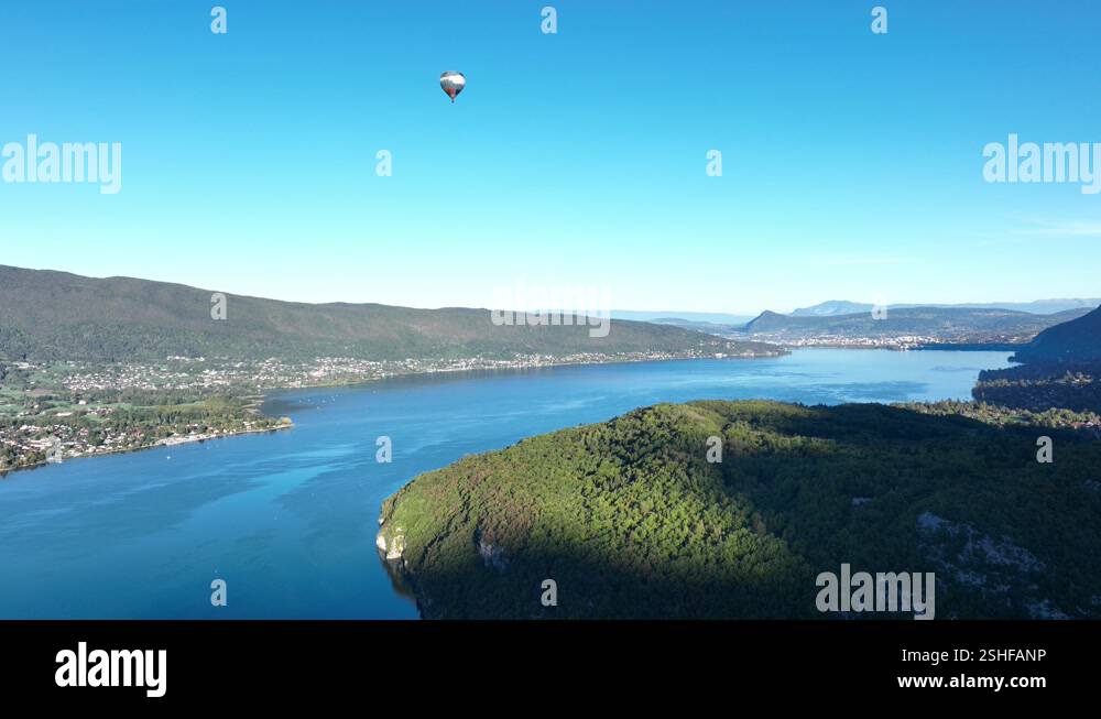 Hot air balloons hovering over Annecy lake in a summer morning Stock ...