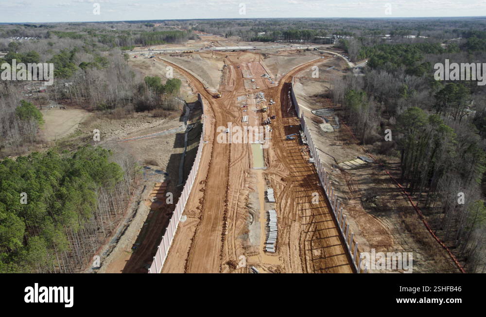 Wide drone shot of large highway construction, 540 Beltline North ...