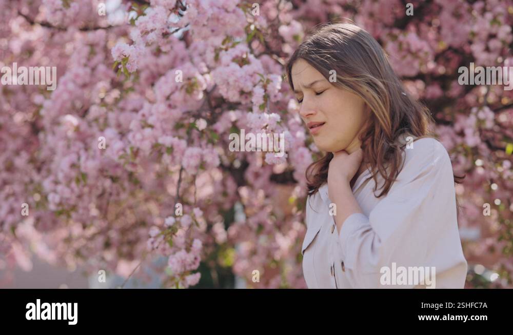 Allergic woman using inhaler during spring flowering Stock Video ...