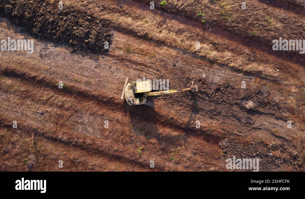Excavator dig ground at construction site Stock Video Footage - Alamy