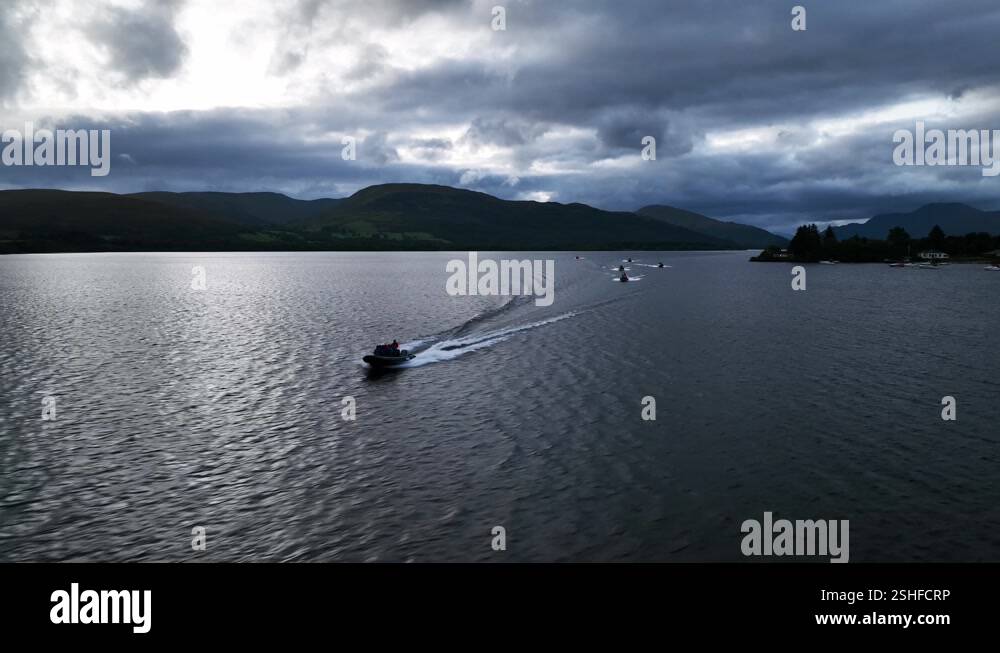 Cinematic Close Up Pan Around Boats Cruising on Loch Lomond in Scotland ...