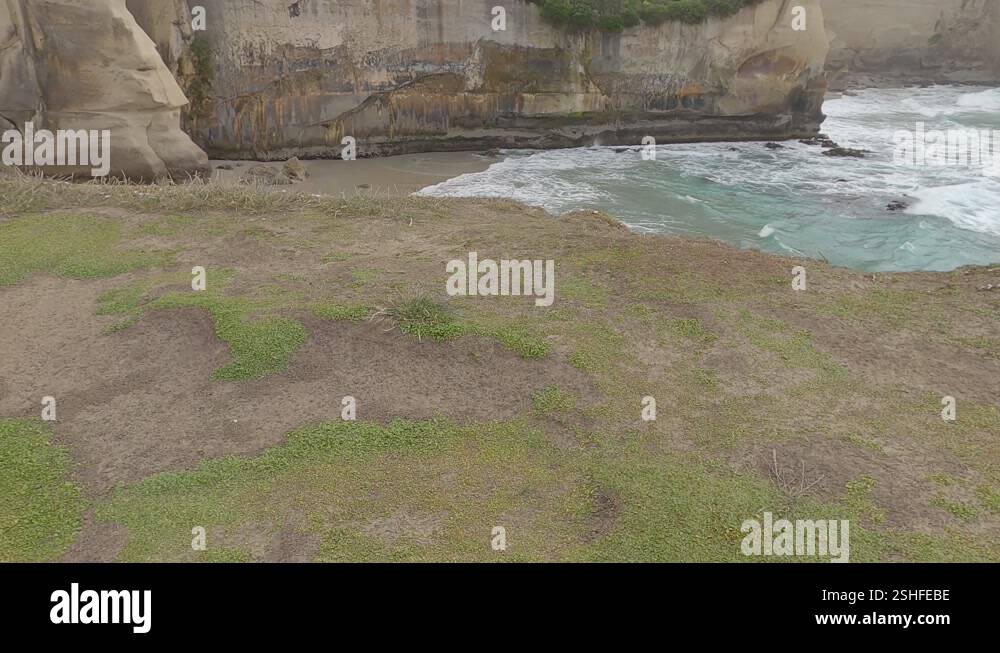 Slow walk across headland revealing amazing sandstone cliffs - Tunnel ...