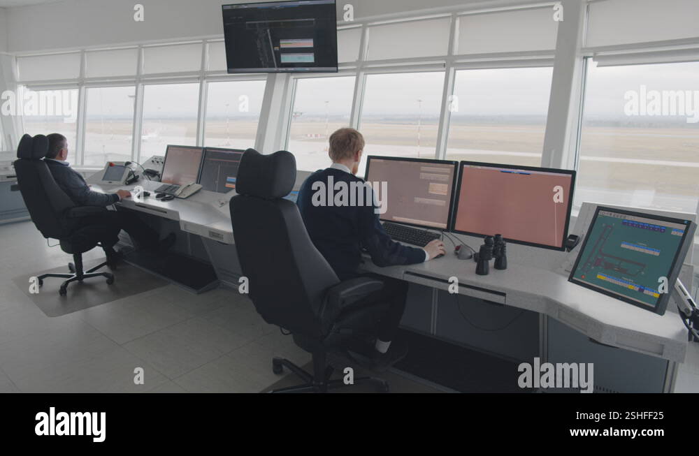 Air Traffic Controllers Work on Computer with multiple Screens in Airport Tower Stock Video ...