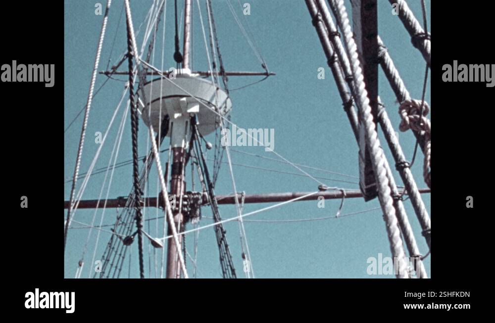 1970s: The mast and rigging of a large sailing ship. The bow of a ship ...