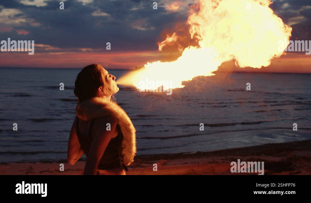 Woman performing fire breathing using burning torch Stock Video Footage ...