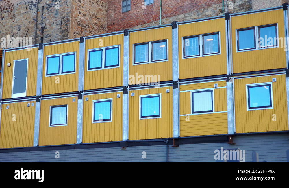 Container homes and offices on a construction site - yellow shipping ...