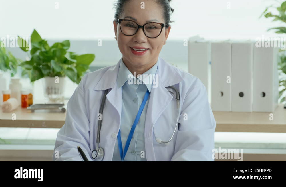 Experienced Doctor Making Medical Notes by Her Workplace Stock Video ...
