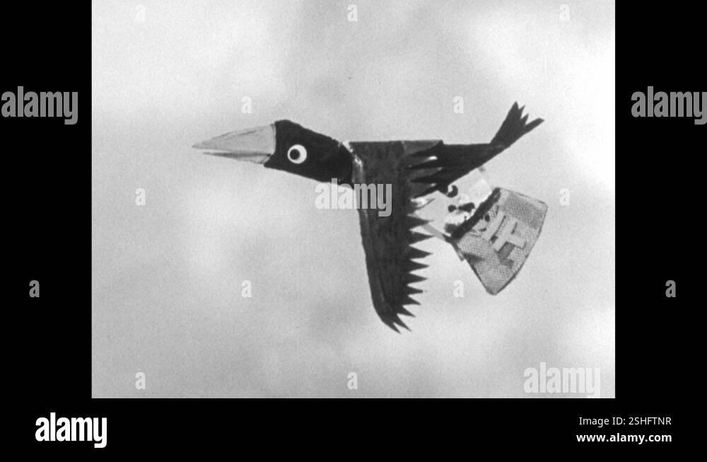 1960s: Animation. Mouse swings on vine and lands on fence. Mouse calls ...