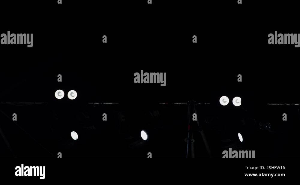 flashing and rotating light beams from stage lights on a construction ...