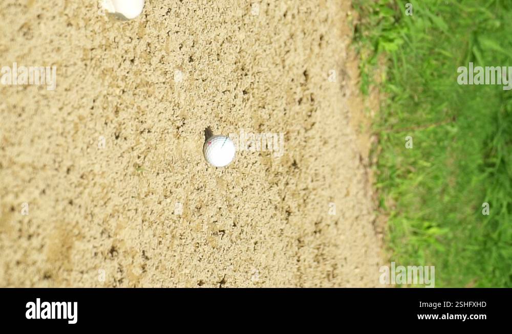 Throwing golf ball, kicking up dirt on the swing in slow motion ...
