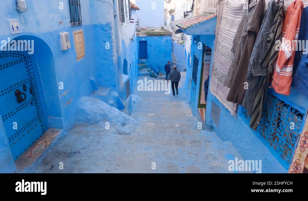 Male Walking Down Local Street Steps In Chefchaouen In Morocco Stock ...