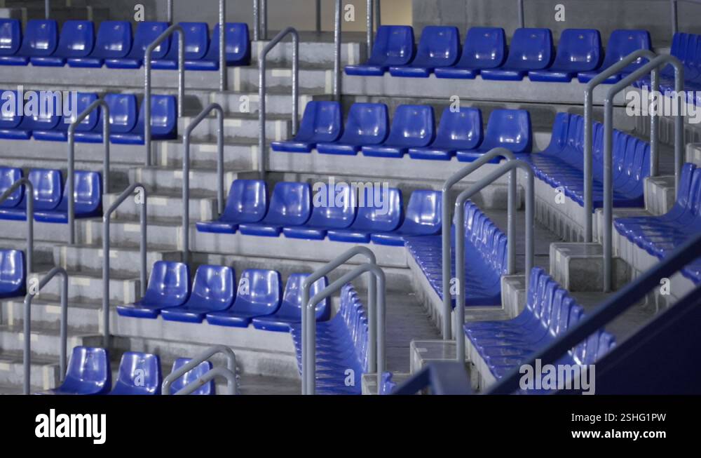 Empty fan seats in sports stadium during lockdown, pan left view Stock ...