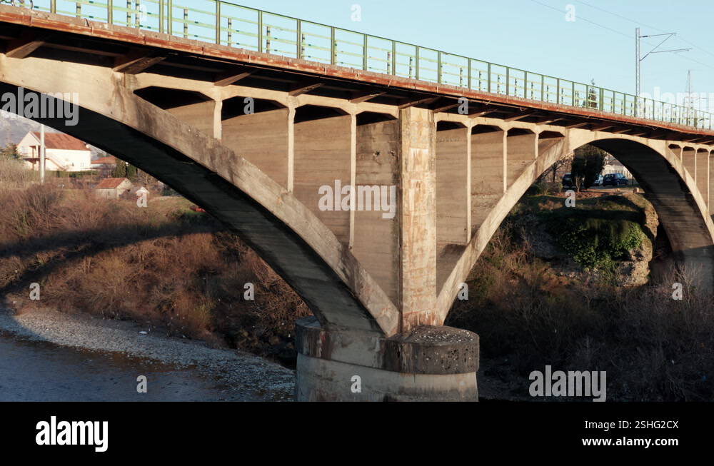 Arch bridge over the river - concrete structure used in transportation ...