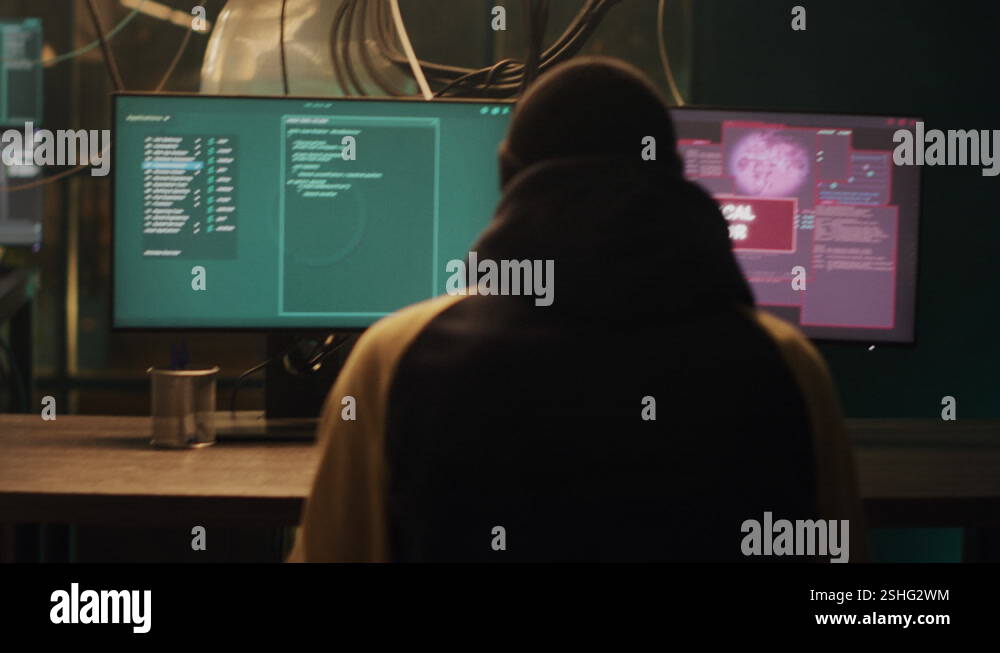 Dark web spy celebrating cyber espionage success on multi monitors ...