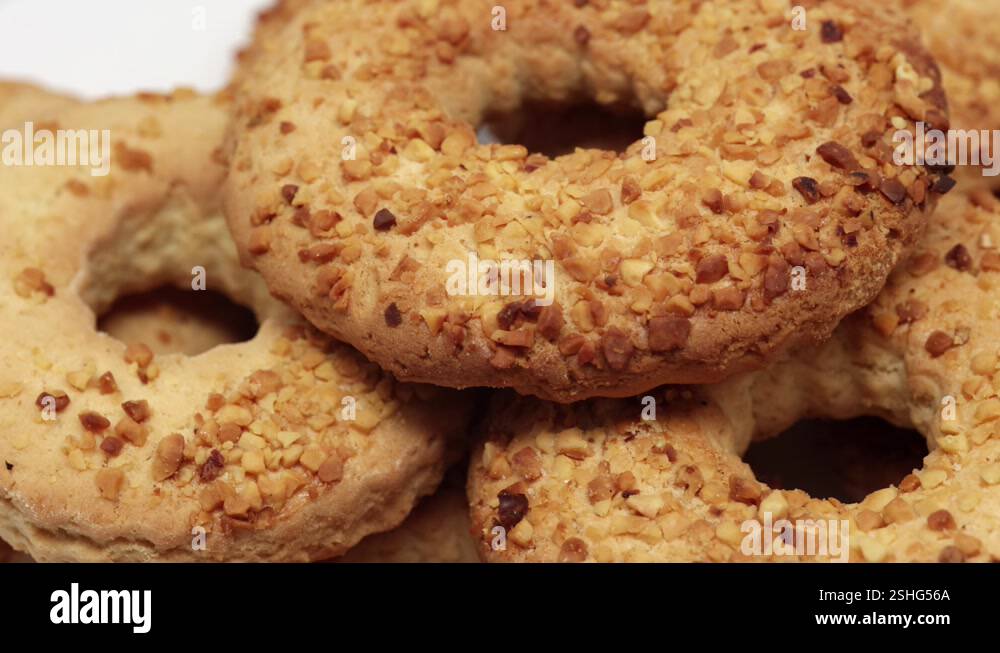 A Ring Of Shortbread Cookies With Peanuts Rotates On A White Background ...