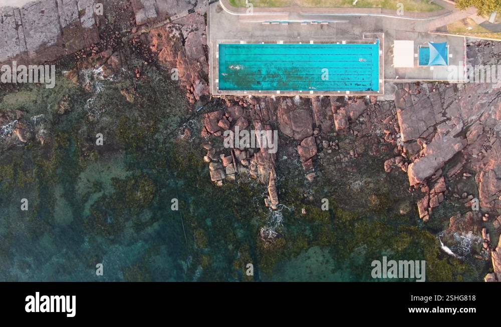 Top down aerial view of a seaside pool in Australia Stock Video Footage ...