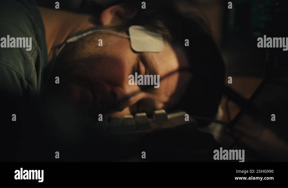 Man rests head on keyboard then opens eyes and wakes with electrodes on ...