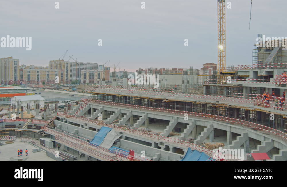 Spectator places carcass and builders at construction site Stock Video ...