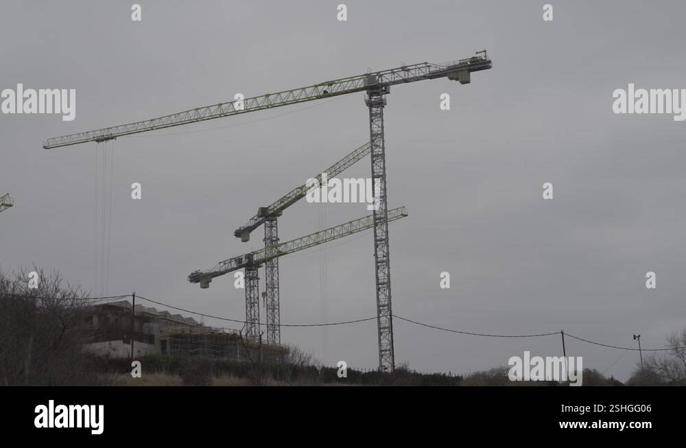 3 cranes construction time lapse. Cranes at the construction site are ...