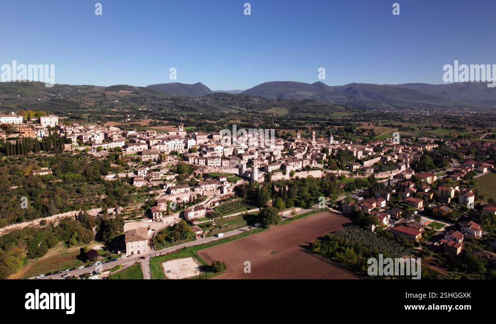 Aerial view of ancient town Spello in a green landscape on a sunny day ...