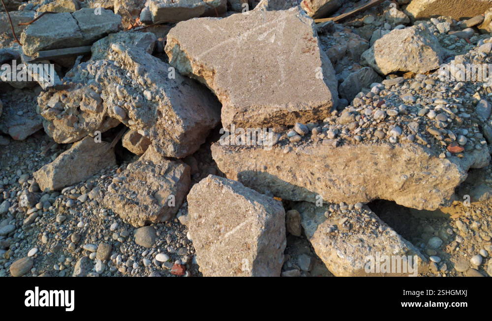 Rubble on the demolition site of a reinforced concrete building. Pile ...