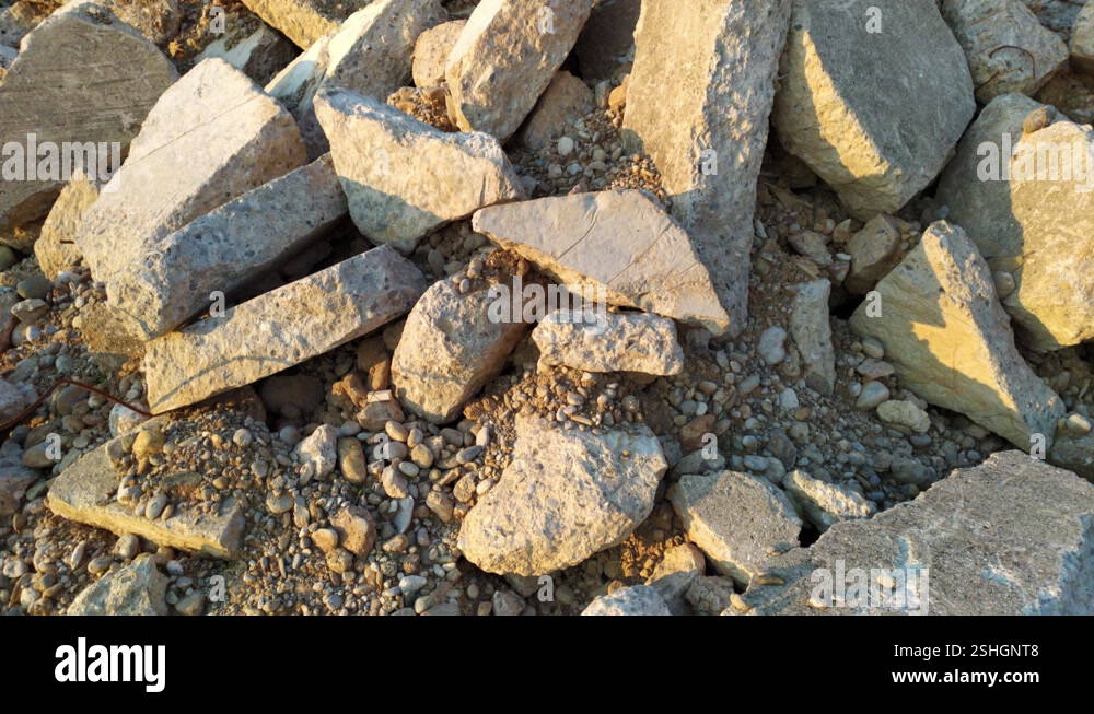 Rubble on the demolition site of a reinforced concrete building. Pile ...